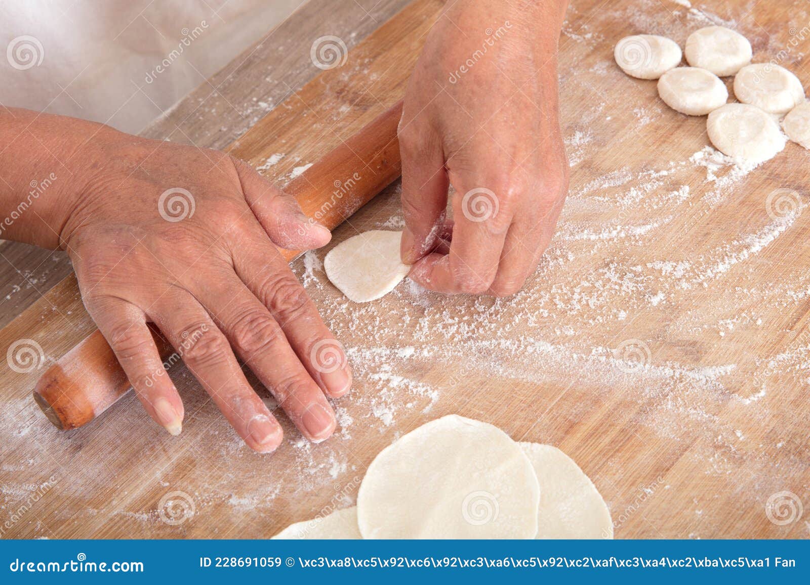 Roll the Dumpling Wrapper on the Chopping Board with a Rolling Pin ...