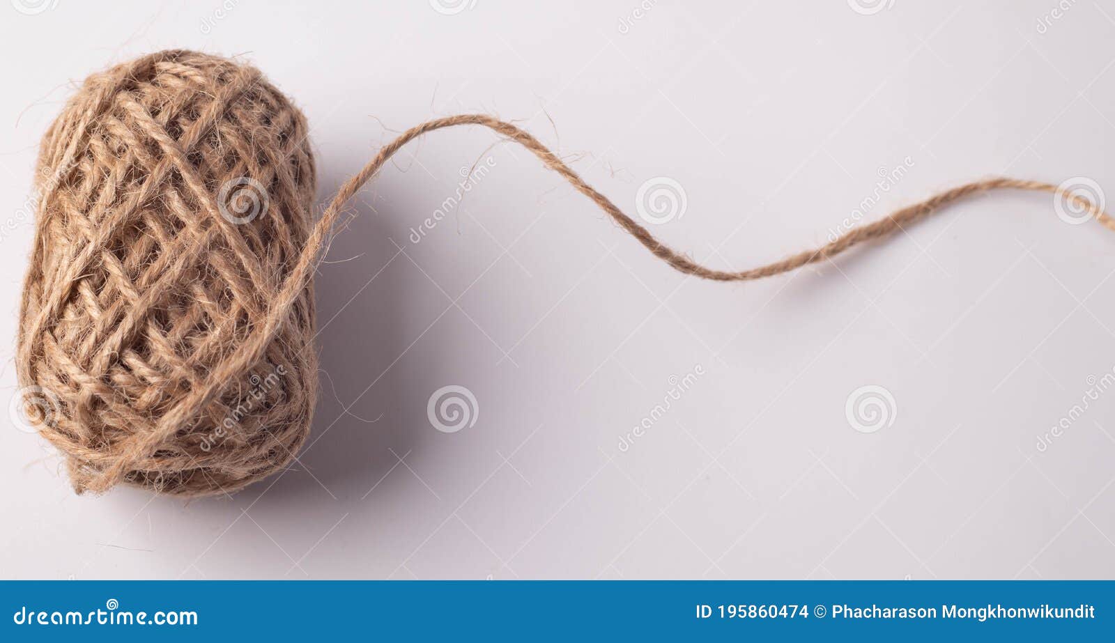 A Roll of Light Brown Rope on a White Background Stock Photo - Image of ...