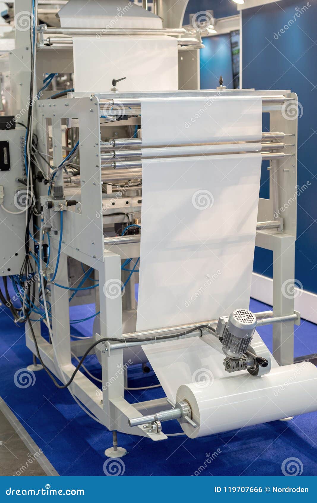 Roll of Packaging Film. Feeding Unit of a Modern Packaging Machine ...