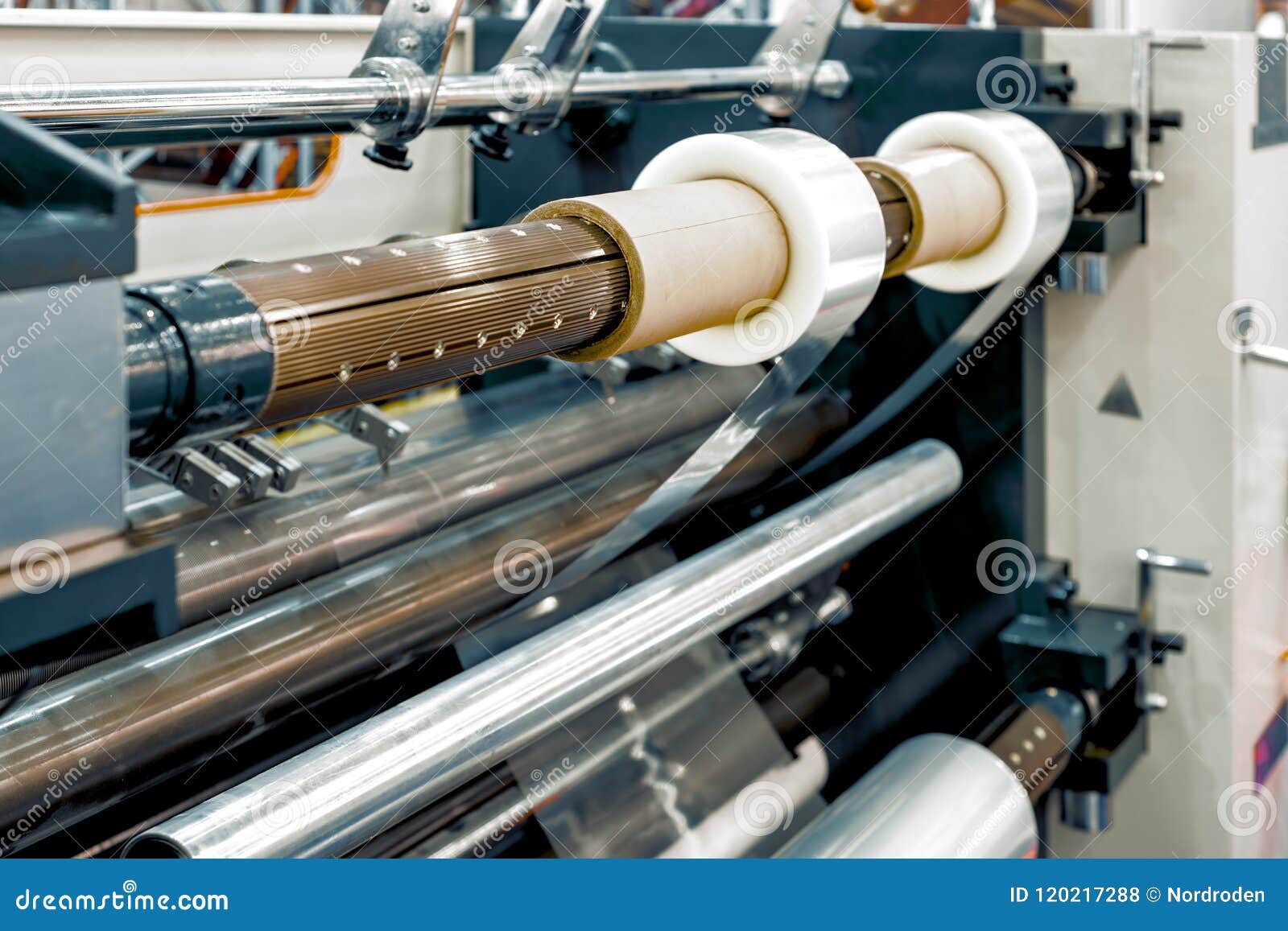 Roll of Packaging Film. Feeding Unit of a Modern Packaging Machine ...