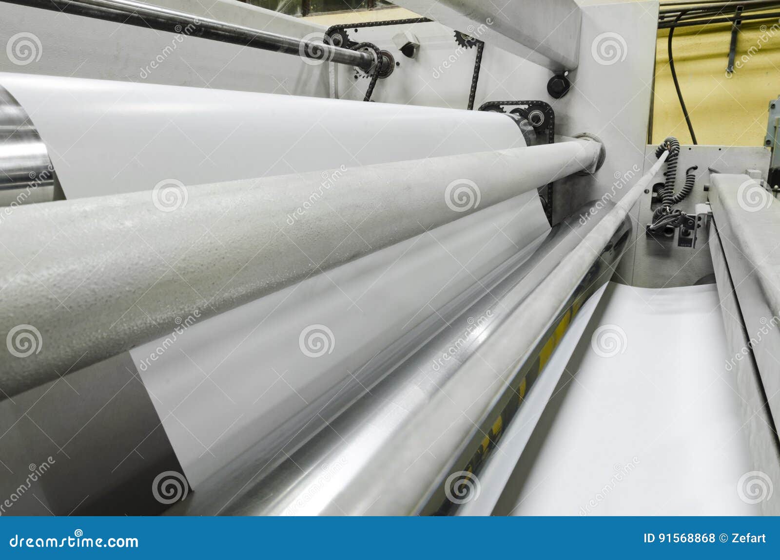 Roll of Paper Goes Fast among Rollers Stock Photo - Image of massive ...