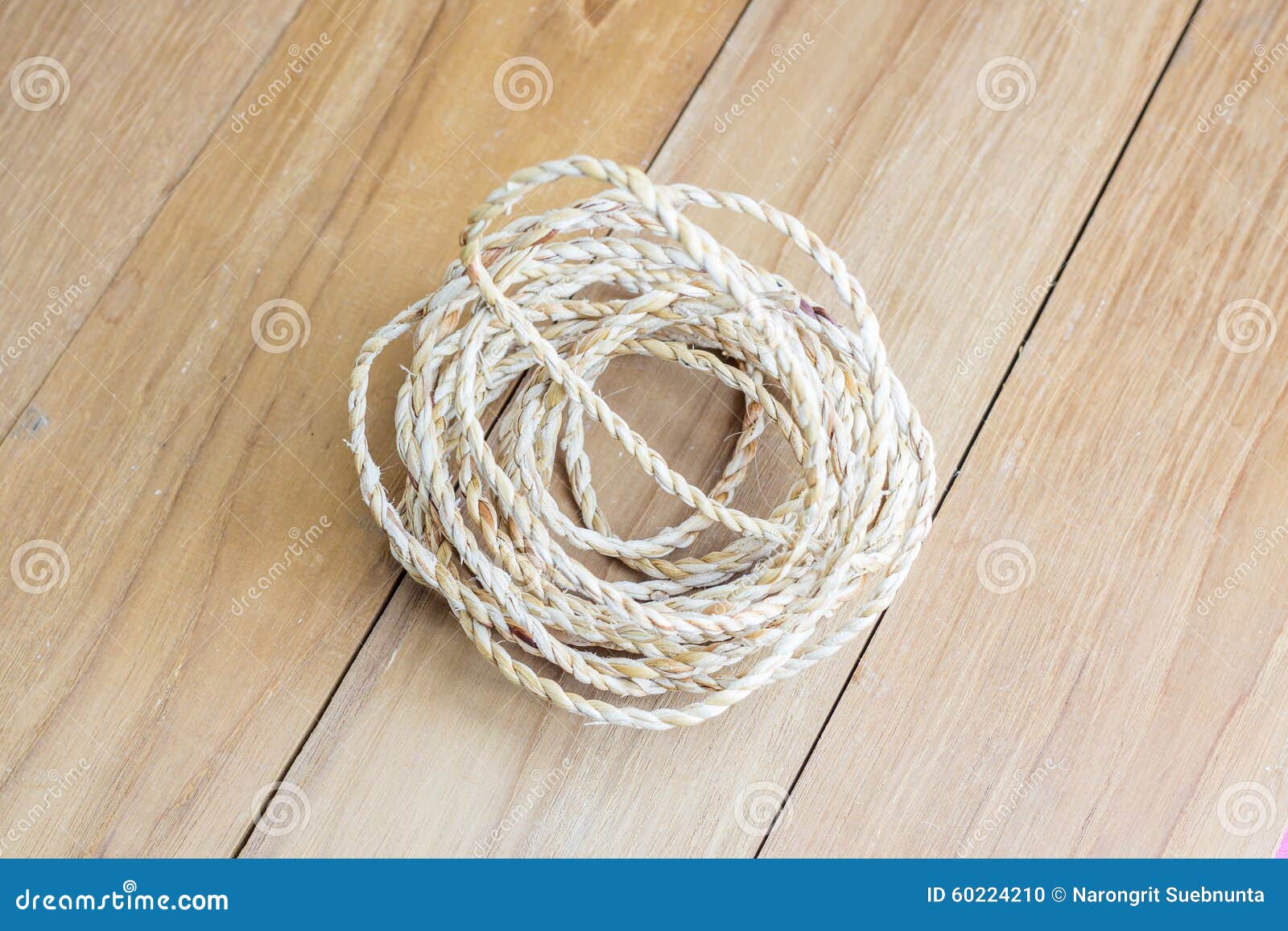 Roll rope on wooden board stock photo. Image of path - 60224210