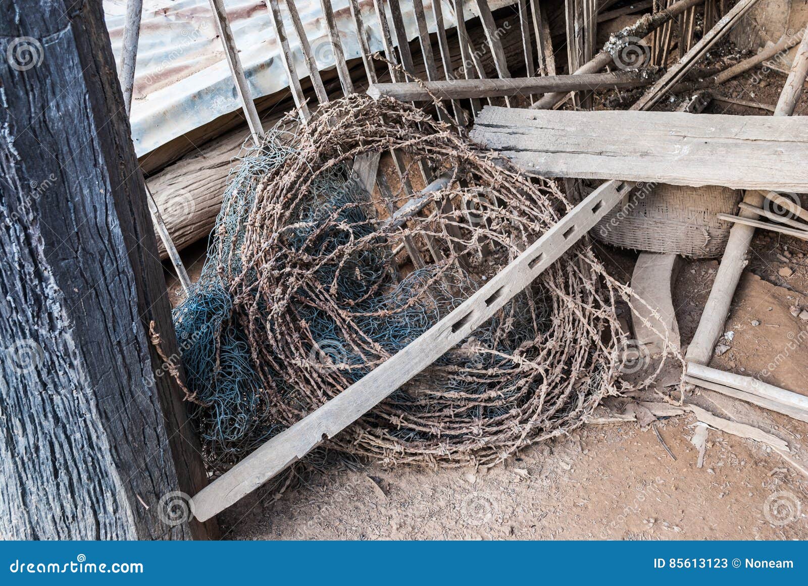 Roll of Rusty Barbed Wire and Dirty Nylon Net Stock Image - Image of ...