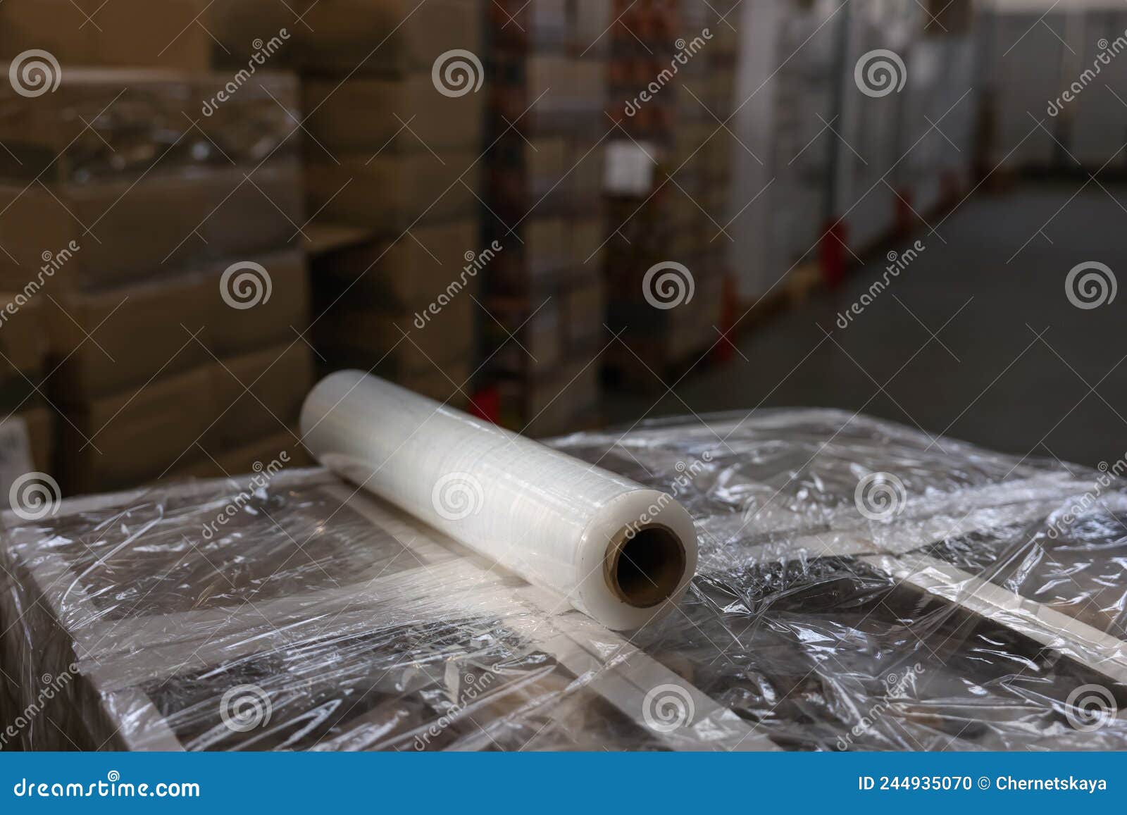 Roll of Stretch Wrap on Box in Warehouse Stock Photo - Image of indoors ...