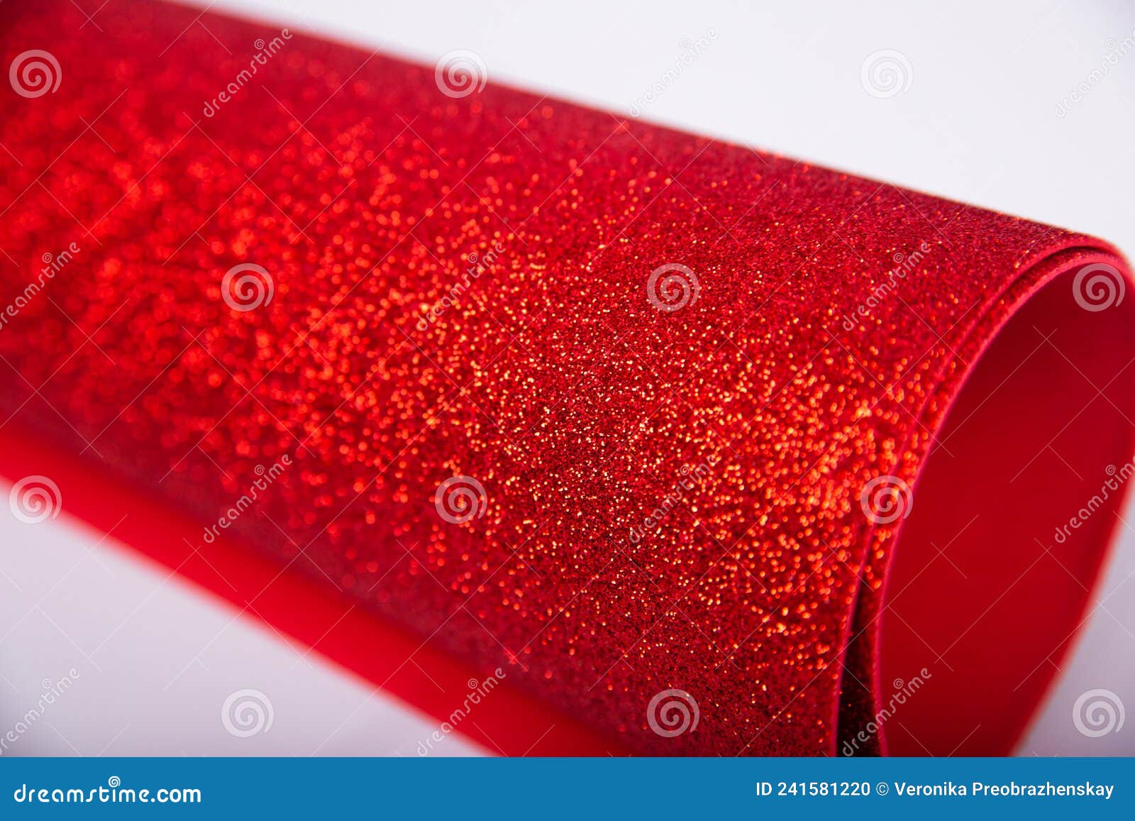 A Roll of Thick Red Paper with Sparkles on a White Background. Shiny ...
