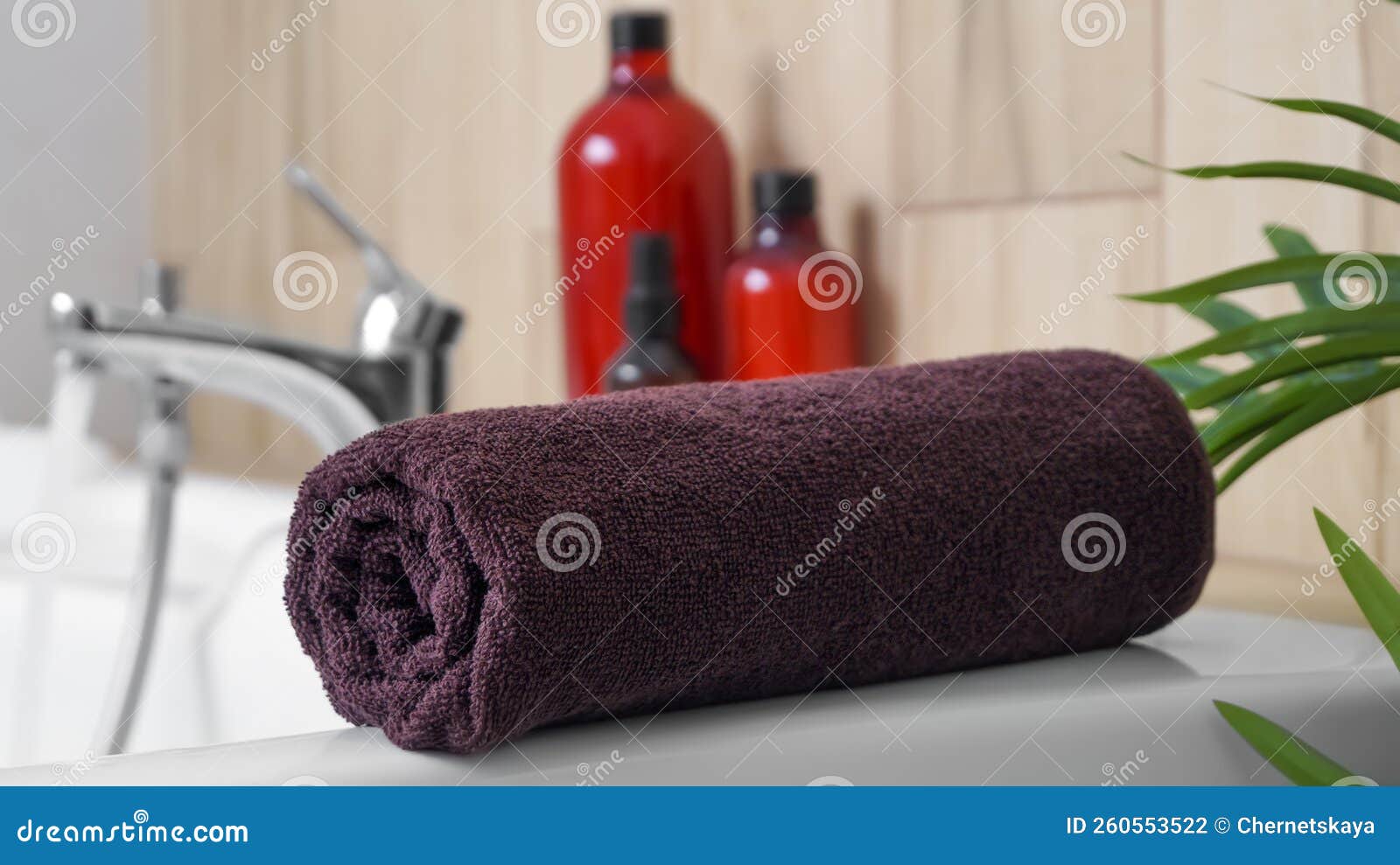 Rolled Bath Towel on Tub in Bathroom Stock Photo - Image of hotel, care ...