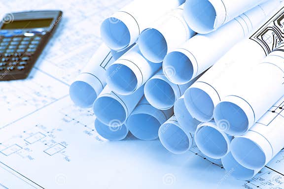 Rolled Blueptint and Calculator Stock Image - Image of paperwork, chart ...