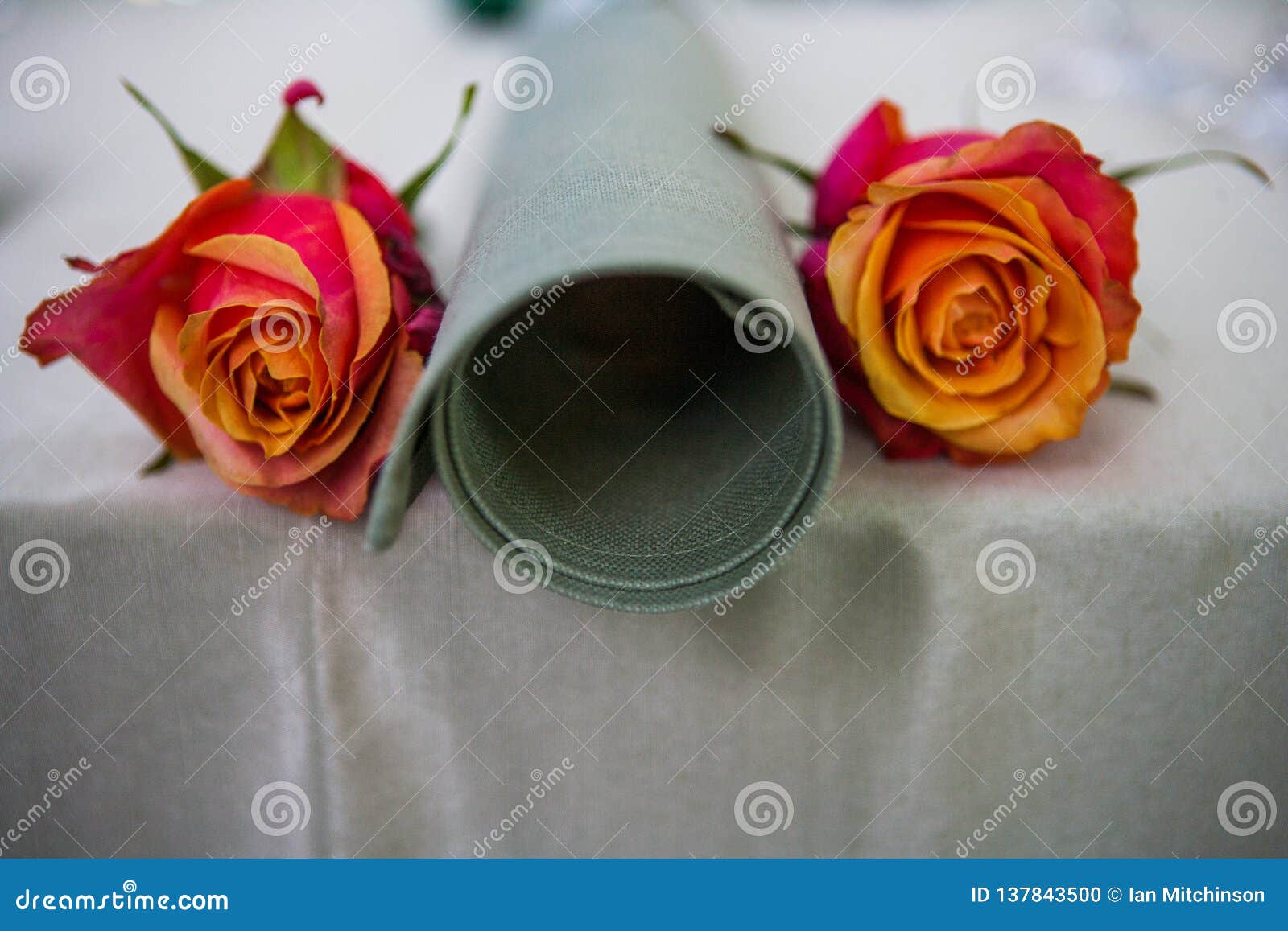 A Rolled Circular Table Handkerchief Table Setting with Pink and ...