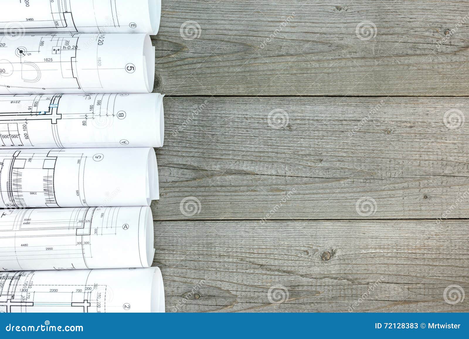 Rolled Construction Plans and Technical Drawings on Gray Wooden Stock ...