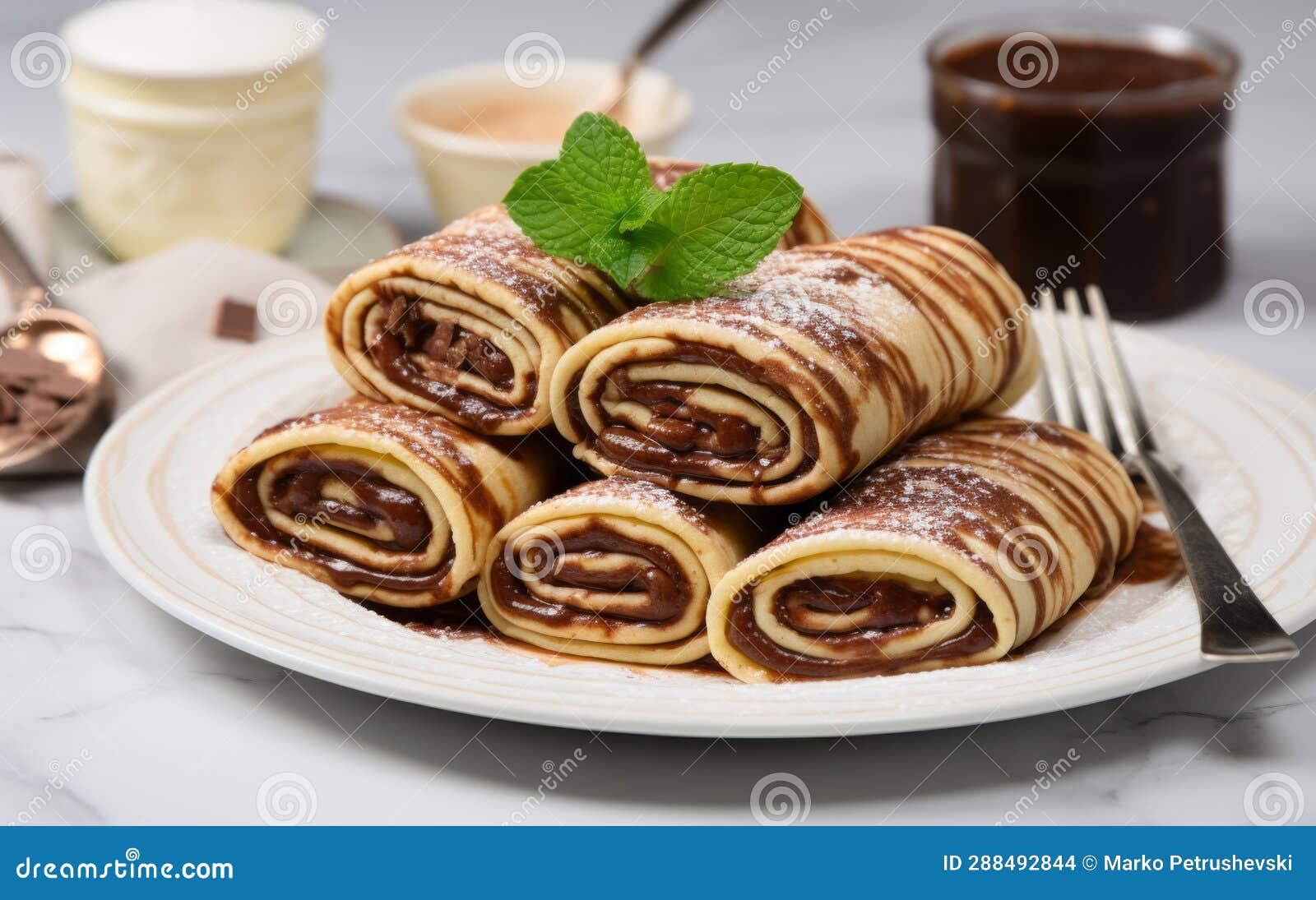 Rolled Crepes or Tiny Pancakes with Rich Chocolate, Displayed on a ...