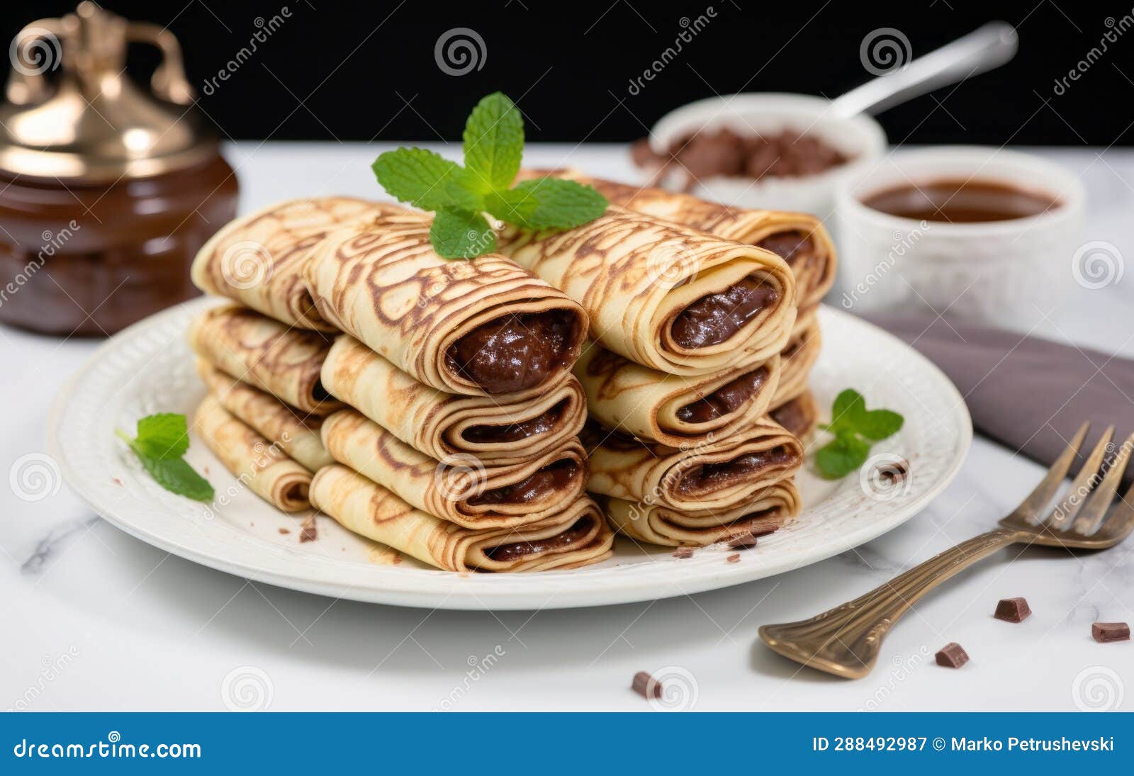 Rolled Crepes or Tiny Pancakes with Rich Chocolate, Displayed on a ...