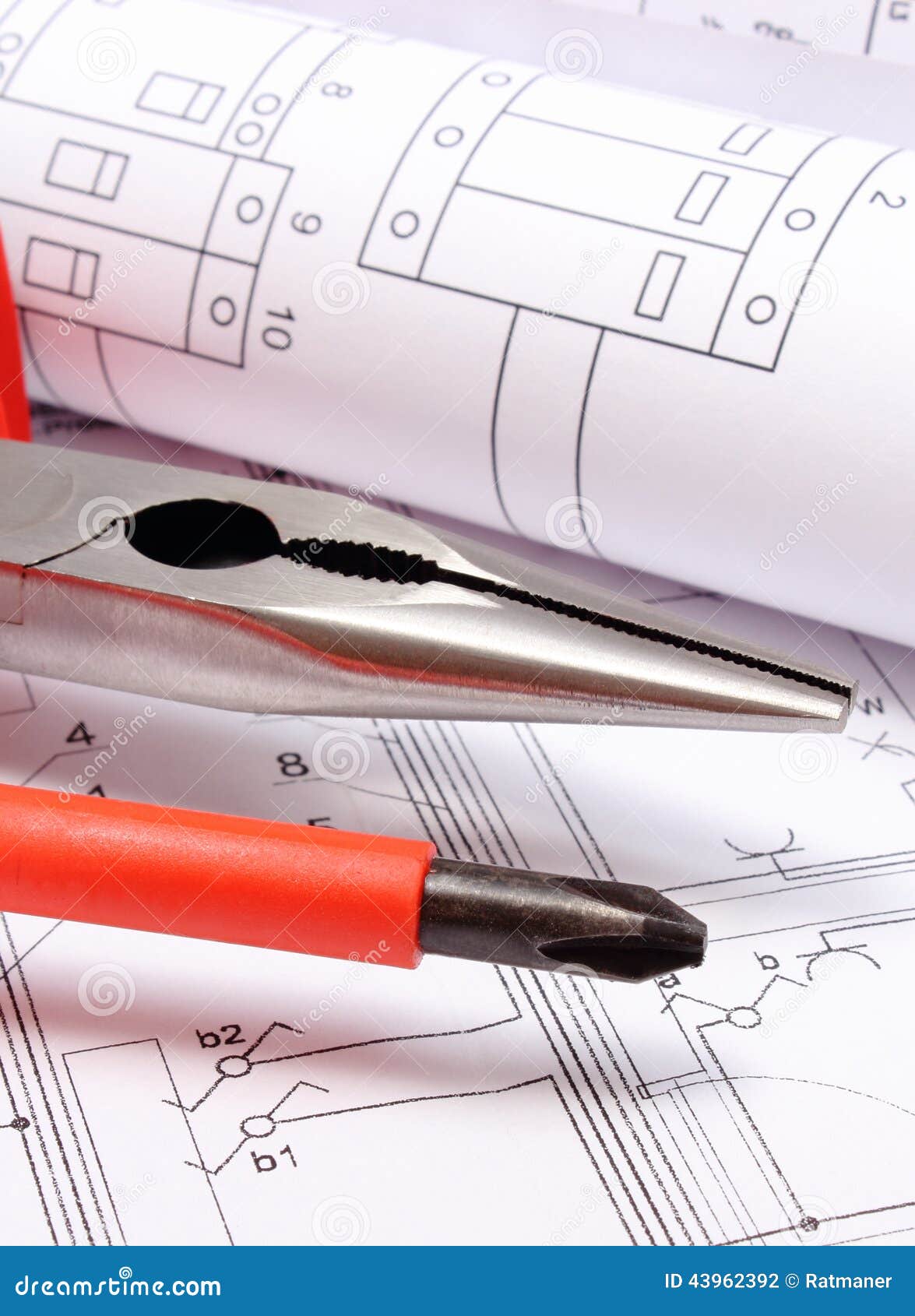 Rolled Electrical Diagrams and Work Tools on Construction Drawing of ...