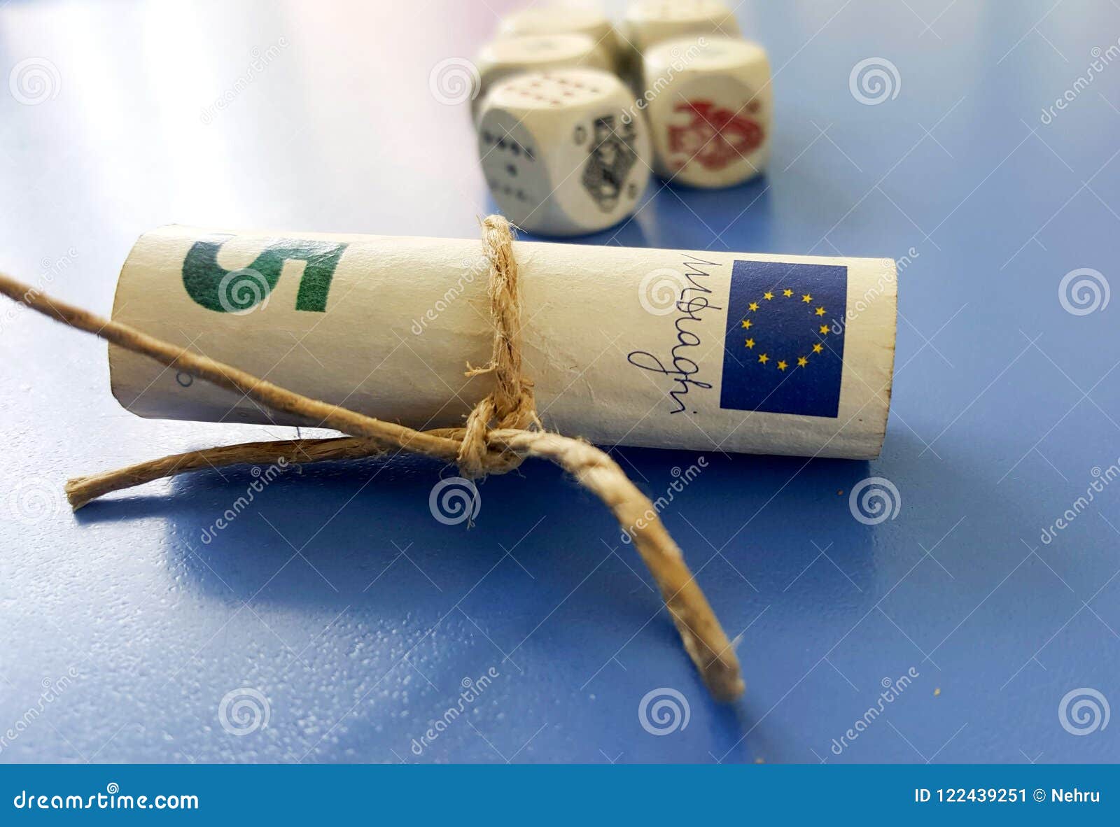 Rolled Euro Banknote on a Blue Background Stock Image - Image of ...