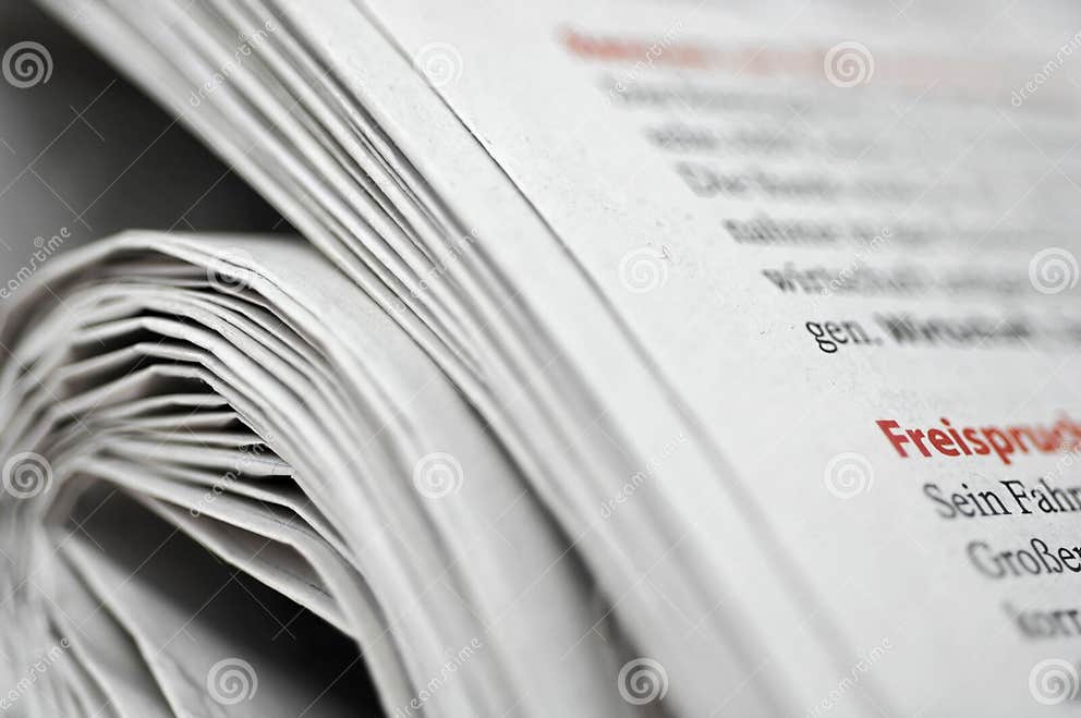 Rolled German newspaper stock image. Image of extra, news - 3320045