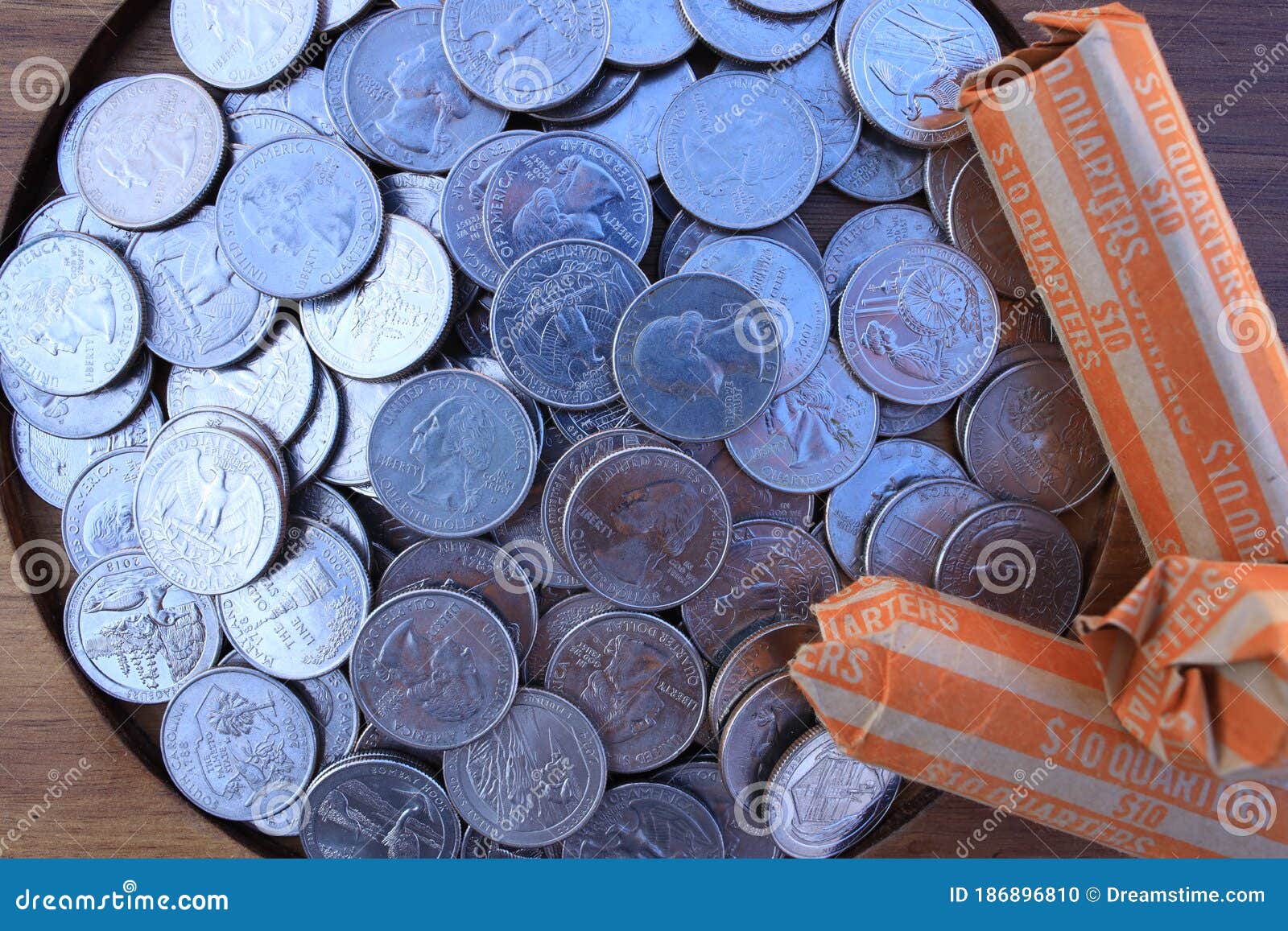 Rolled and loose quarters stock photo. Image of metal - 186896810