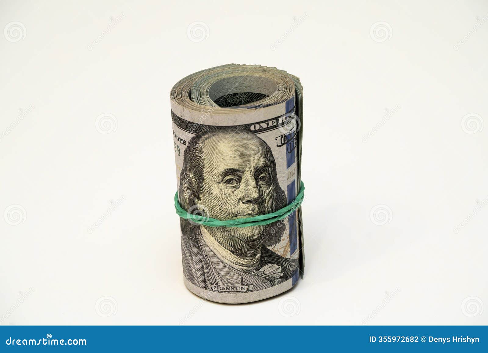 Rolled Money Banknote Secured with a Rubber Band on a White Surface ...