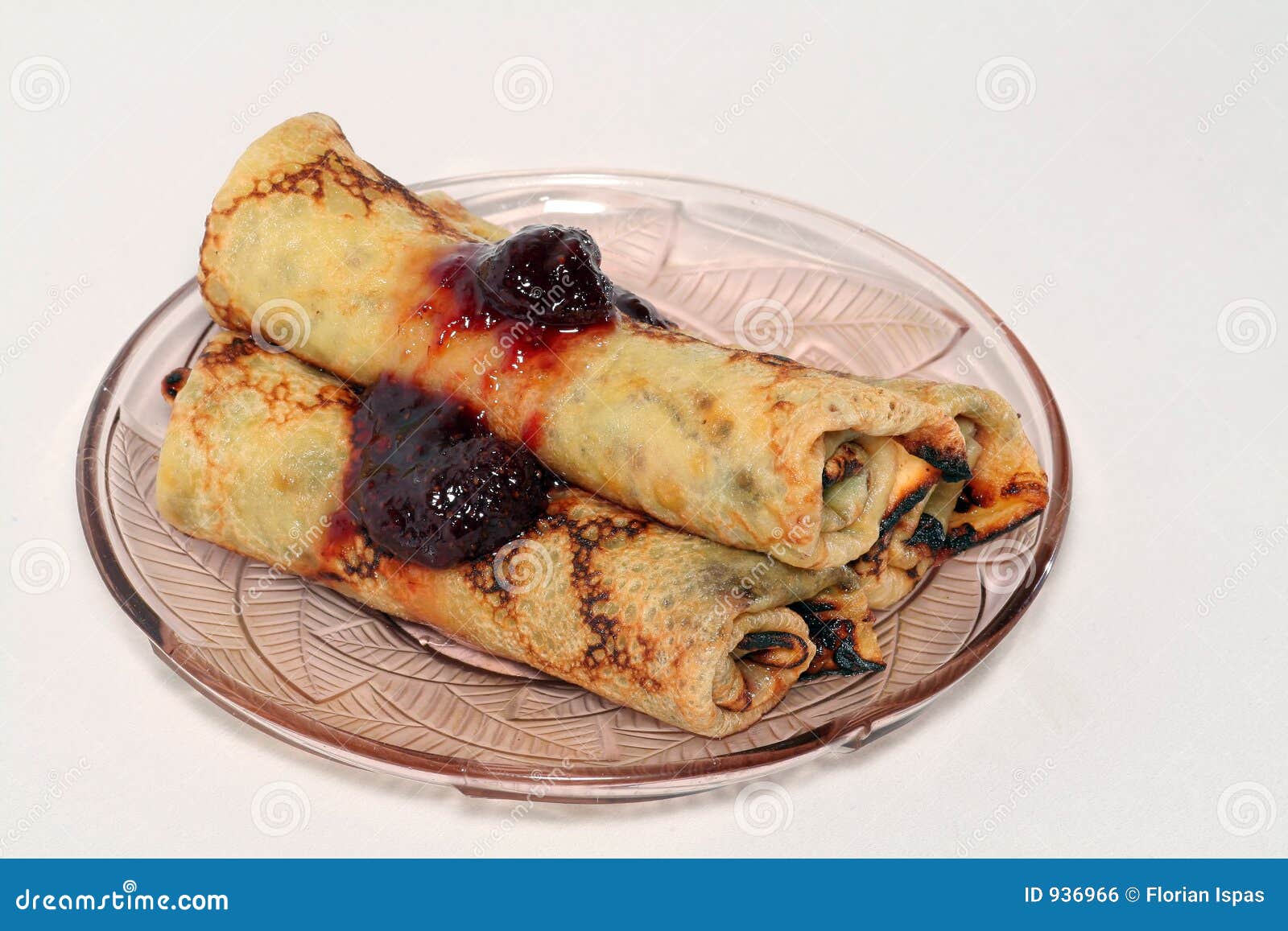 Rolled Pancakes with Strawberry Jam on a Glass Plate Stock Photo ...