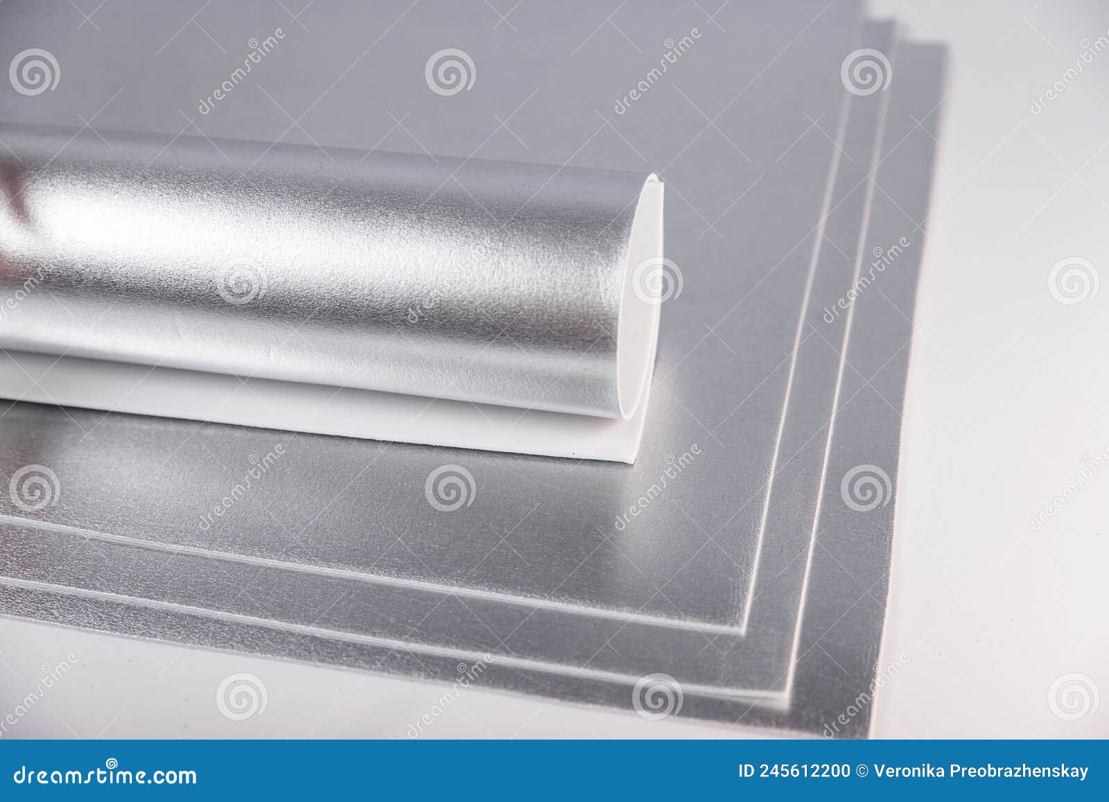 Rolled Silver Sheet of Cardboard. Sheets of Shiny Isolon. Metallic ...