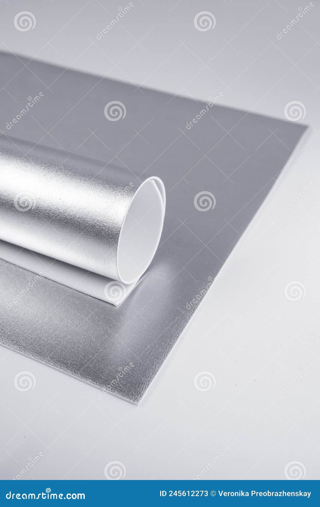 Rolled Silver Sheet of Cardboard. Sheets of Shiny Isolon. Metallic ...