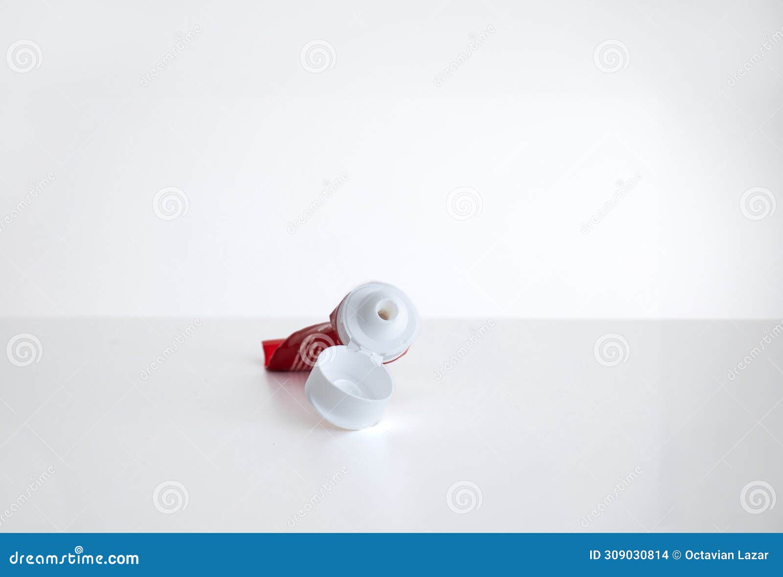 Rolled and Squeezed Out Empty Plastic Toothpaste Tube, Isolated on ...