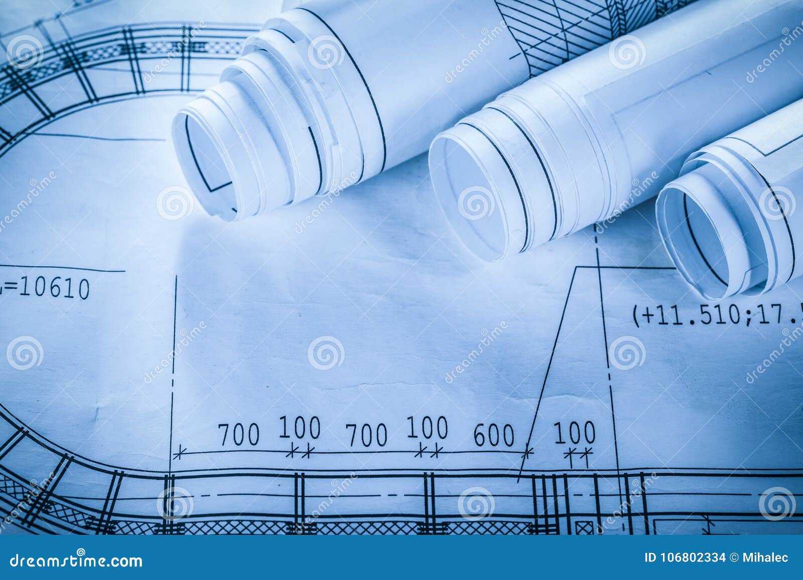 Rolled Up Engineering Drawings on Blueprint Top View Stock Photo ...