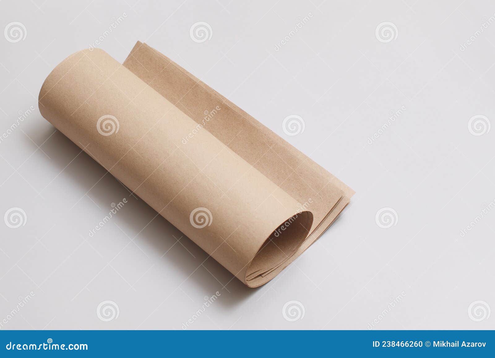 Rolled Up Kraft Paper on a Gray Background Stock Photo - Image of ...