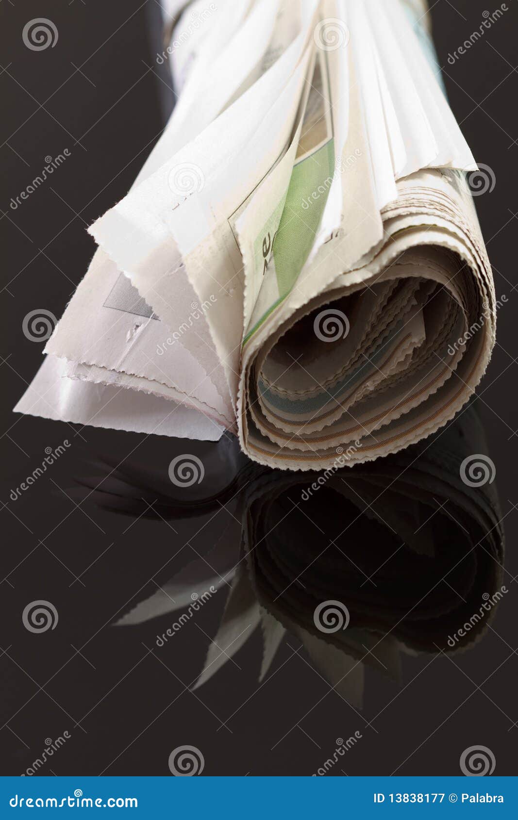 Rolled Up Newspaper on Black 2 Stock Image - Image of rubber, newspaper ...