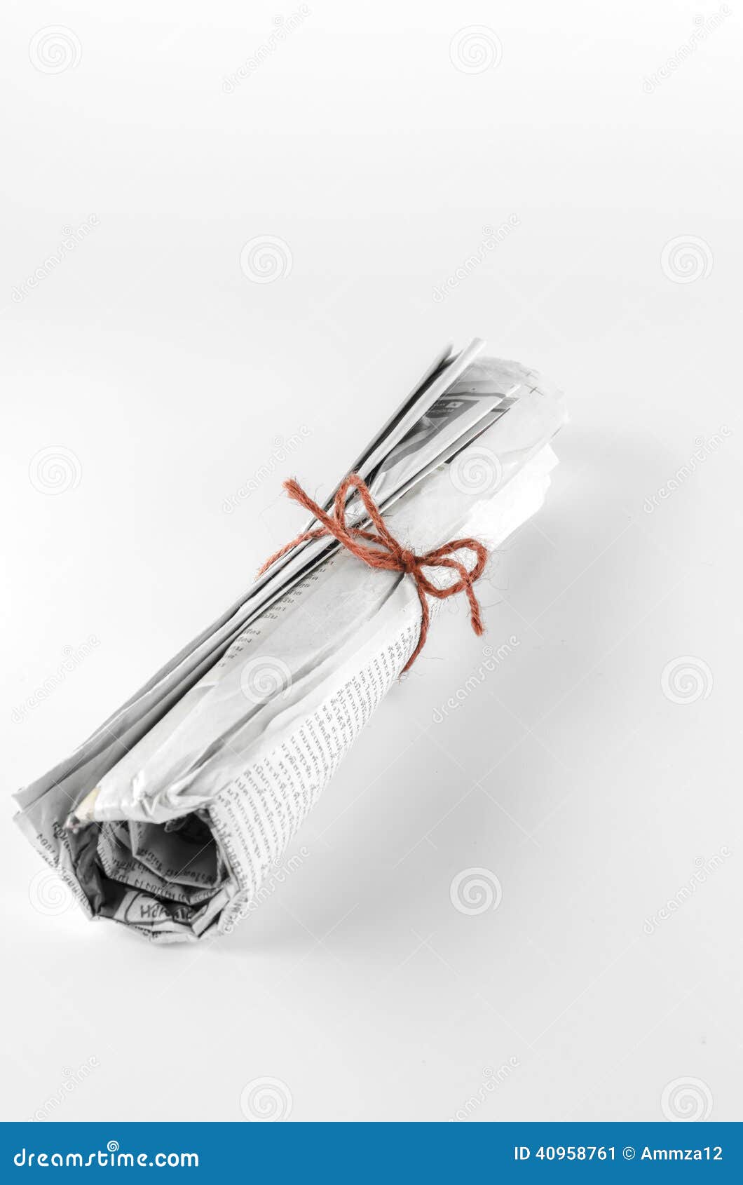 Rolled Up Newspaper Focus on Red Rope Stock Image - Image of object ...