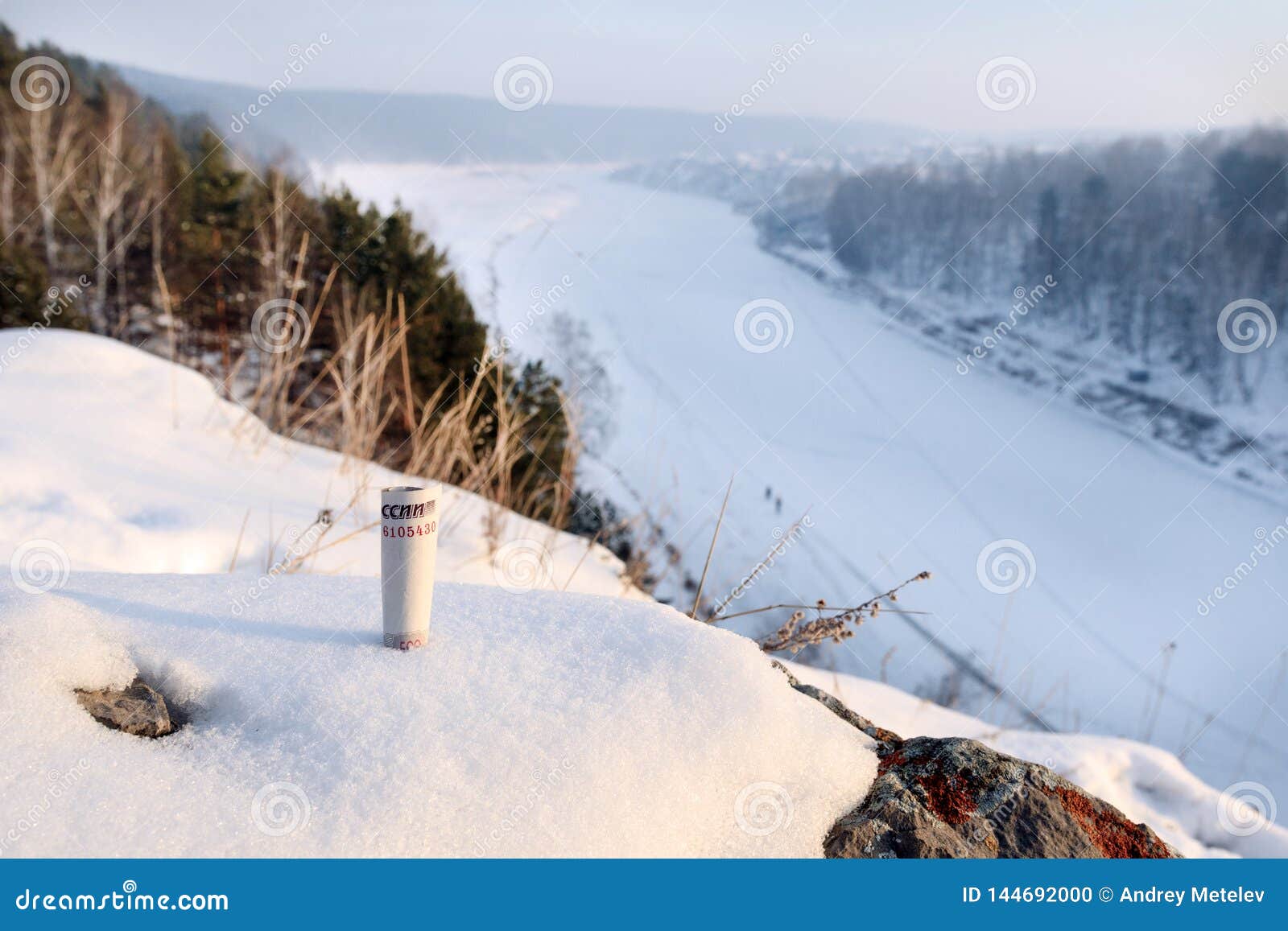 Rolled Up Paper Bill Inserted into the Snow on Top of the Mountain ...