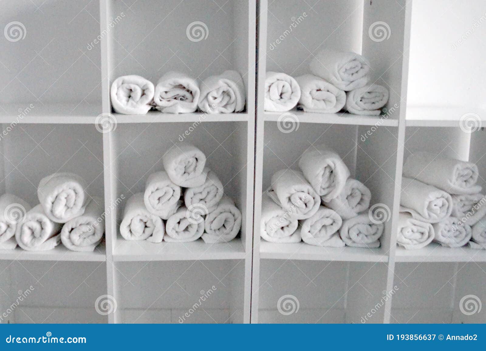 Rolled White Towels on White Shelves Close-up Stock Image - Image of ...