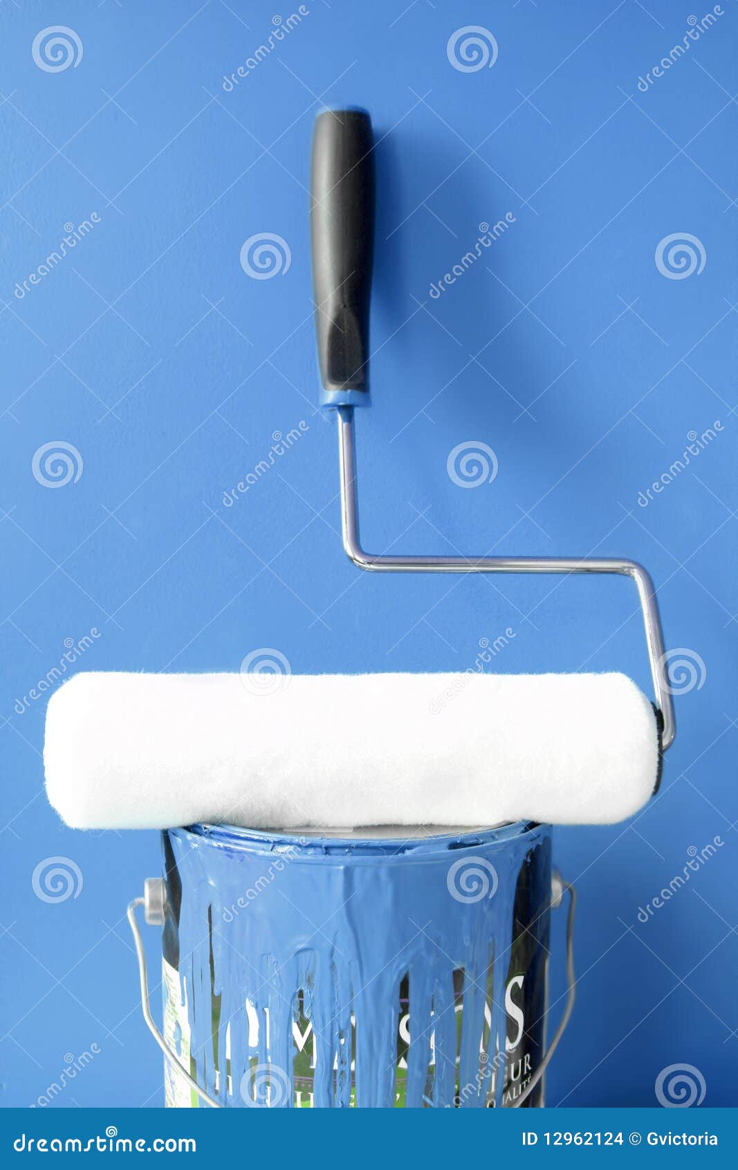 Roller and blue paint stock photo. Image of renovating - 12962124