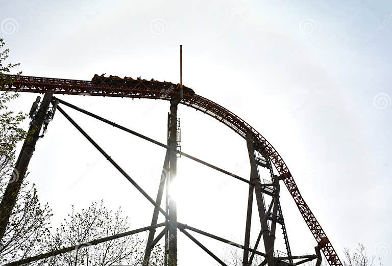 Roller Coaster in the Amusement Park with Sun Stock Image - Image of ...