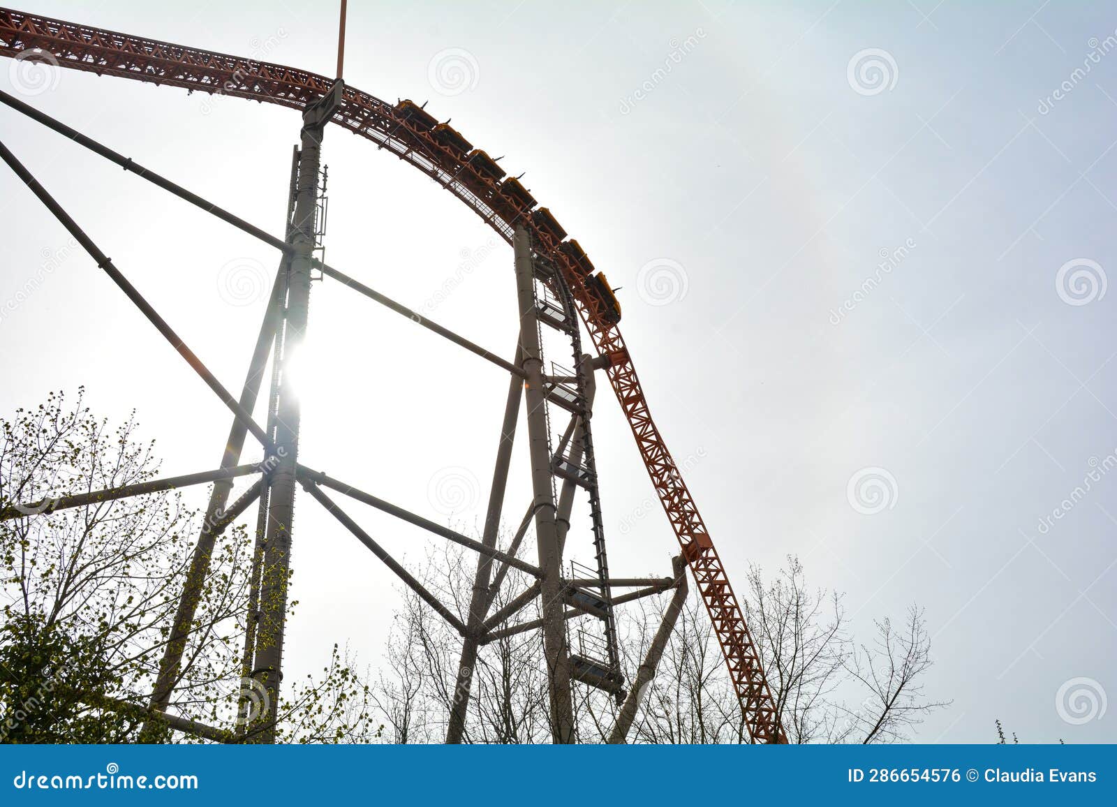 Roller Coaster in the Amusement Park with Sun Stock Photo - Image of ...