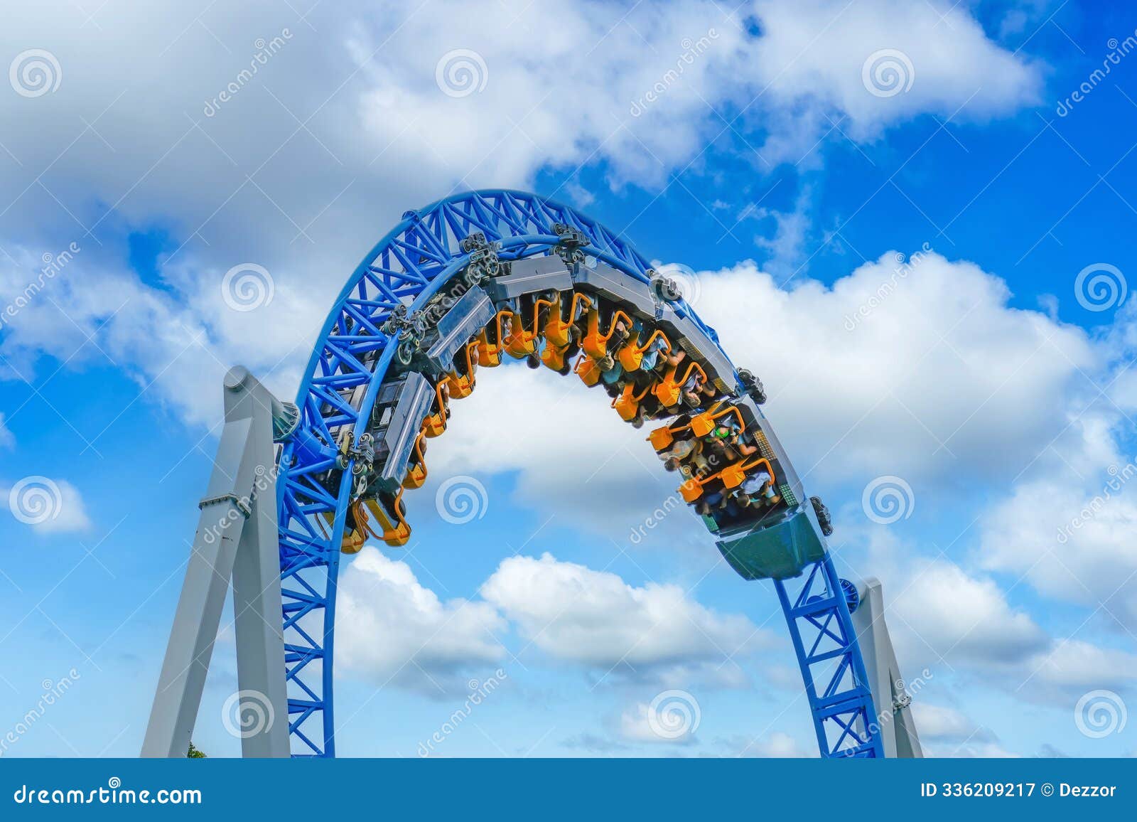 Roller Coaster Cart with People Riding it Goes through a Loop Upside ...