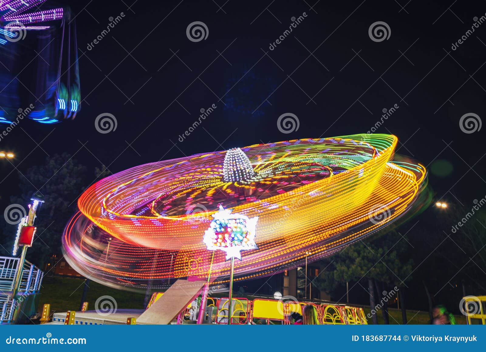 Roller Coaster in Motion, Amusement Park at Night. Long Exposure Stock ...
