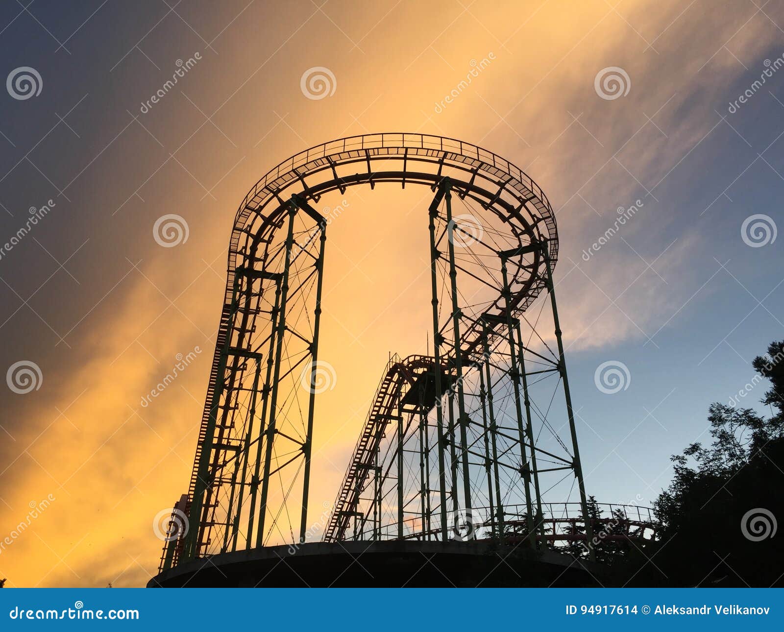 Roller coaster at sunset stock photo. Image of holiday - 94917614