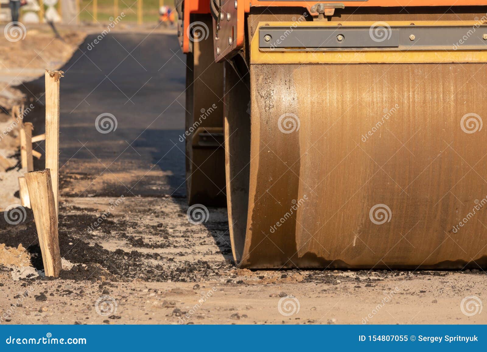 Steamroller Compacting Asphalt In Road Repaving Project. Stock Photo ...