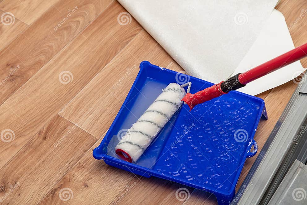 Roller with Glue for Wallpaper Stock Image - Image of spatula, roller ...