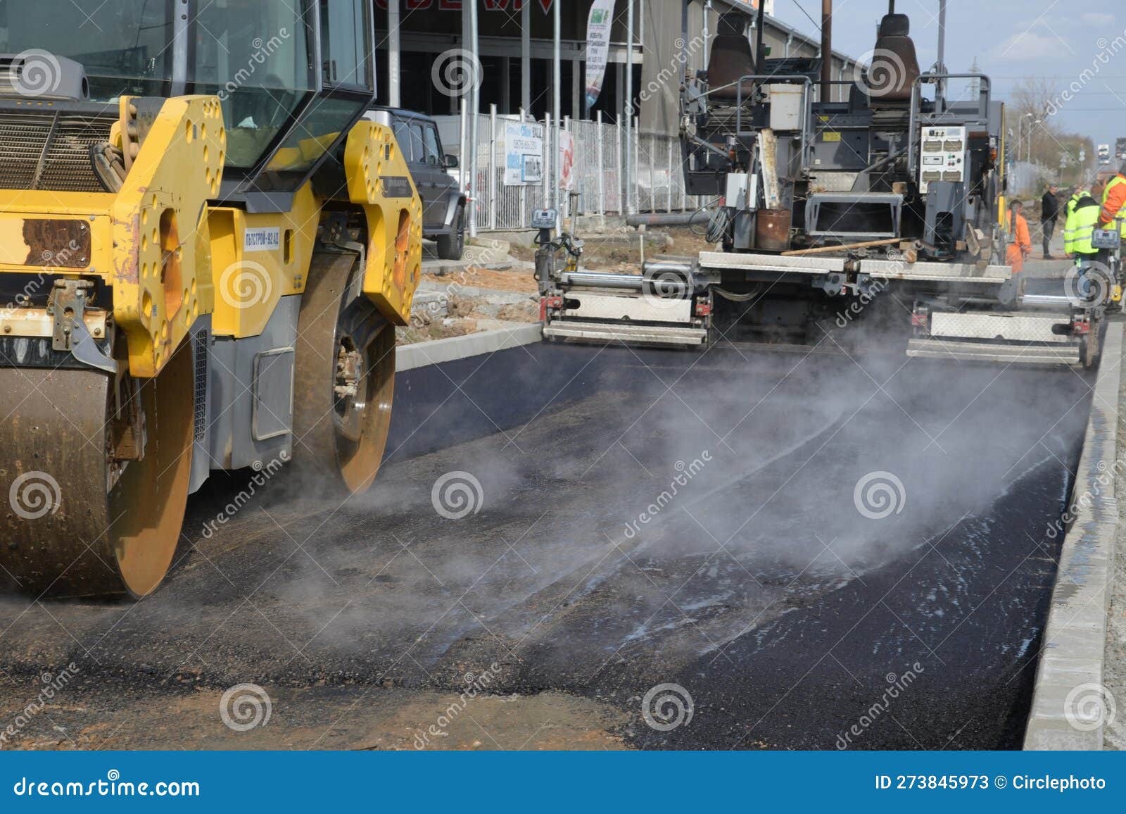 Roller Machine Compressing the Asphalt Behind the Paver Editorial Stock ...