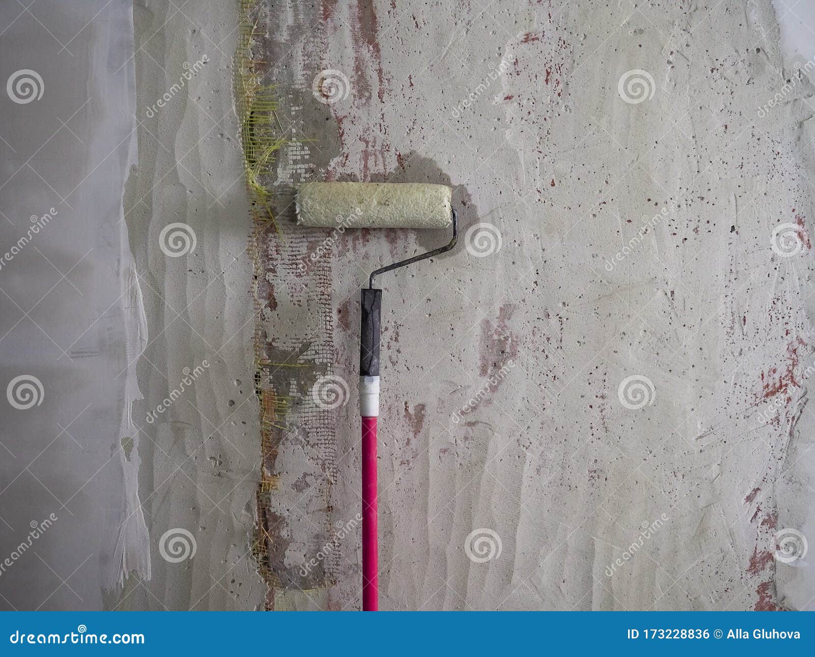 Roller for Repair on the Background of a Concrete Wall, Repair and ...