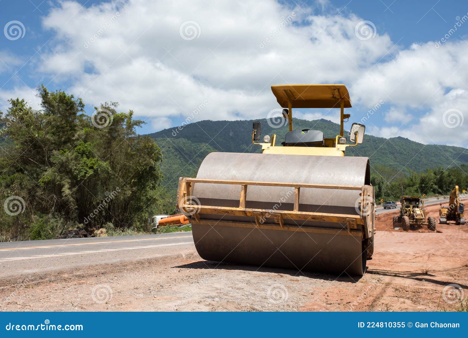 Roller Rolling Fresh Hot Asphalt on the New Road. Road Construction ...