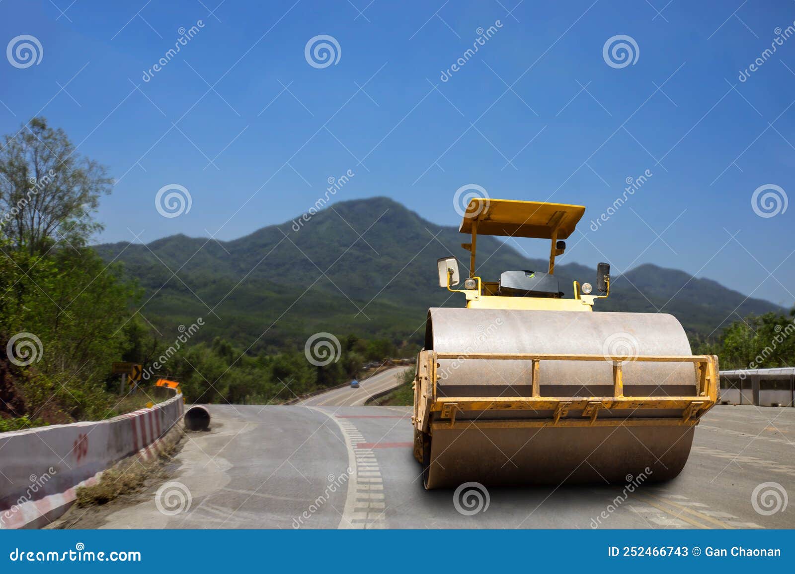 Roller Rolling Fresh Hot Asphalt on the New Road. Road Construction ...
