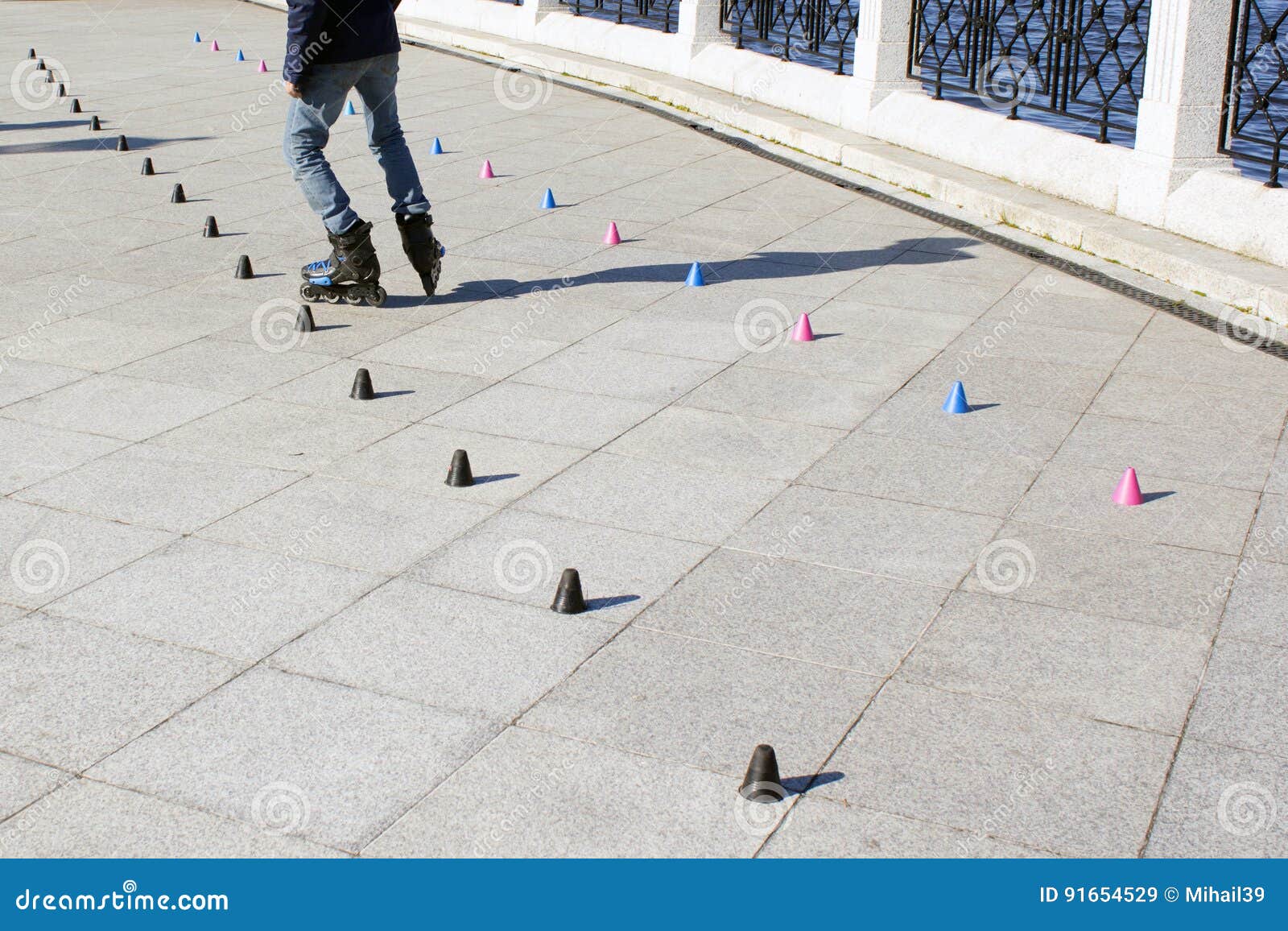 Roller Skater Practicing Slalom Along a Line of Cones Stock Image ...