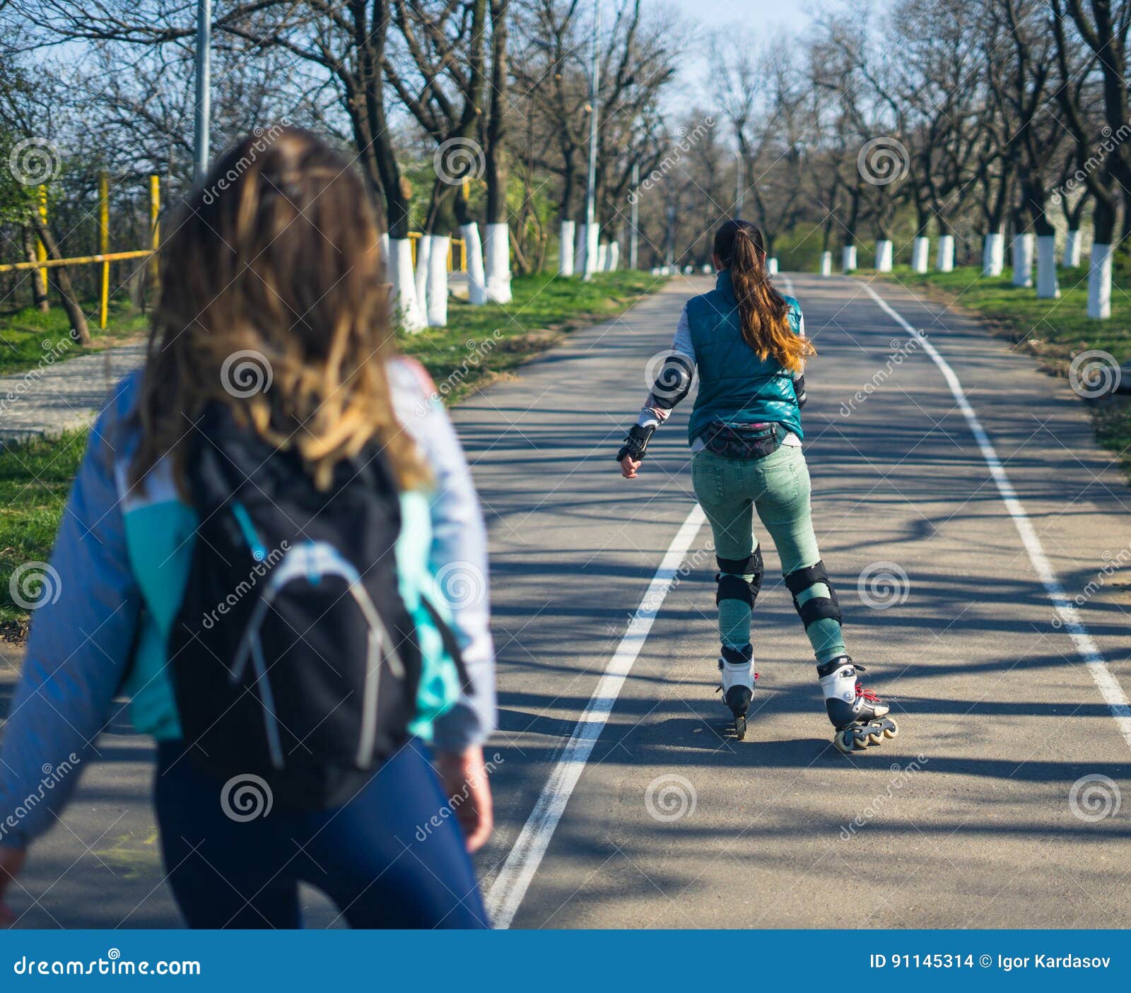 Roller Skating with Two Young and Beautiful Girls Stock Photo - Image ...