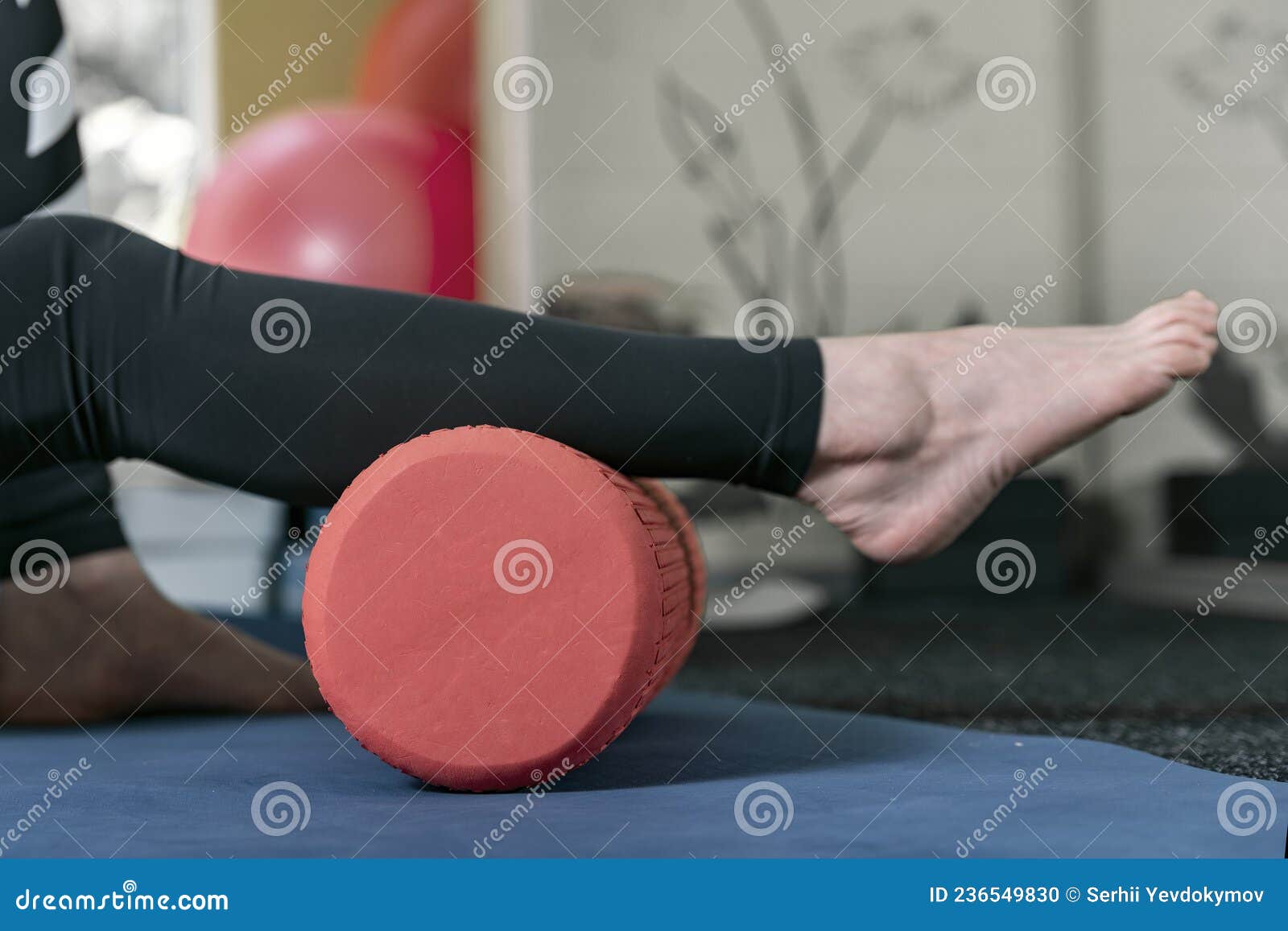 Roller To Roll Out Calf Muscles Woman Using Massage Tool For Foot