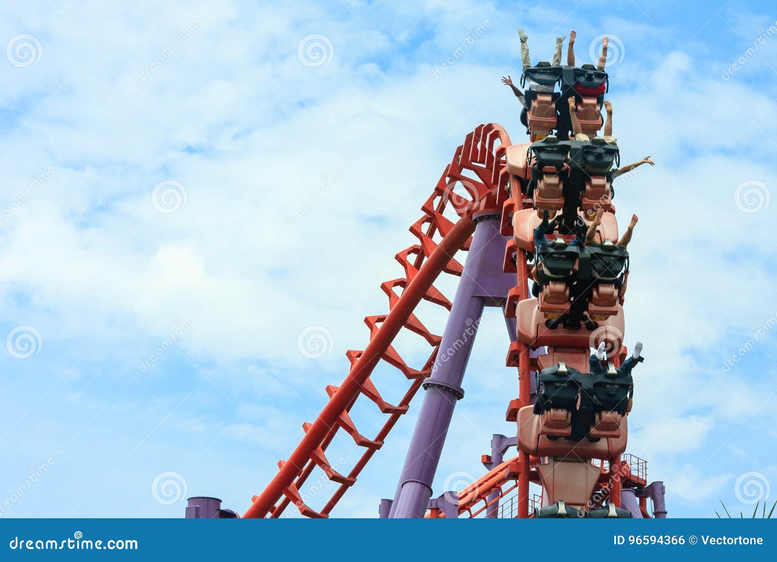 Rollercoaster with People Riding Along the Track in the Amusement Park ... Rollercoaster with People Riding Along the Track in the Amusement Park ...