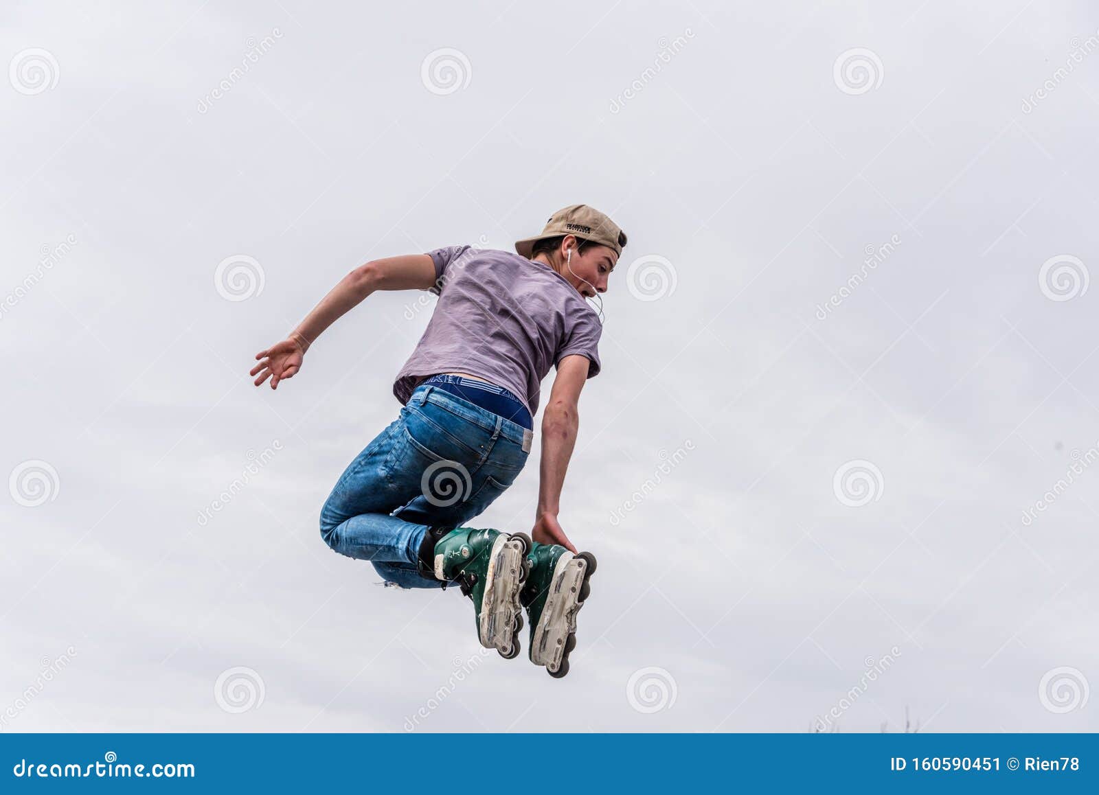 Rollerskater on Halfpipe Flying through the Air from a Low Angle ...