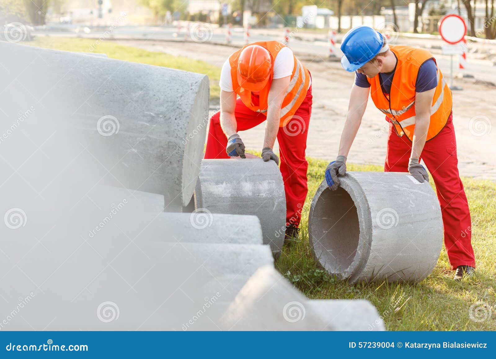 Rolling concrete pipes stock photo. Image of construct - 57239004