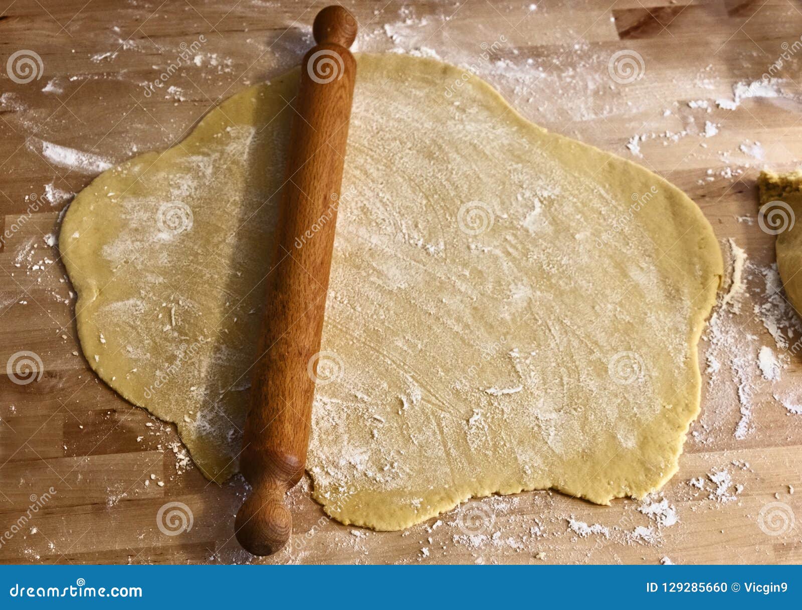 Rolling pin on a dough stock photo. Image of homemade - 129285660