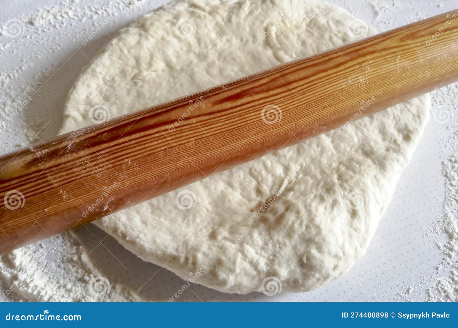 Rolling Pin on the Dough . Roll Out the Dough on the Pizza. Baking ...